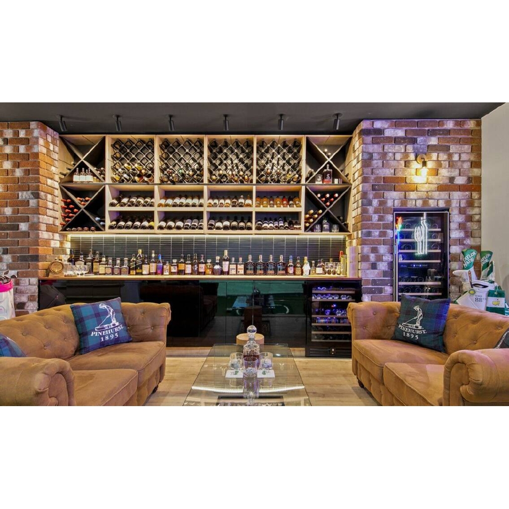 This home has golf options inside and out, along with a whisky bar and ...