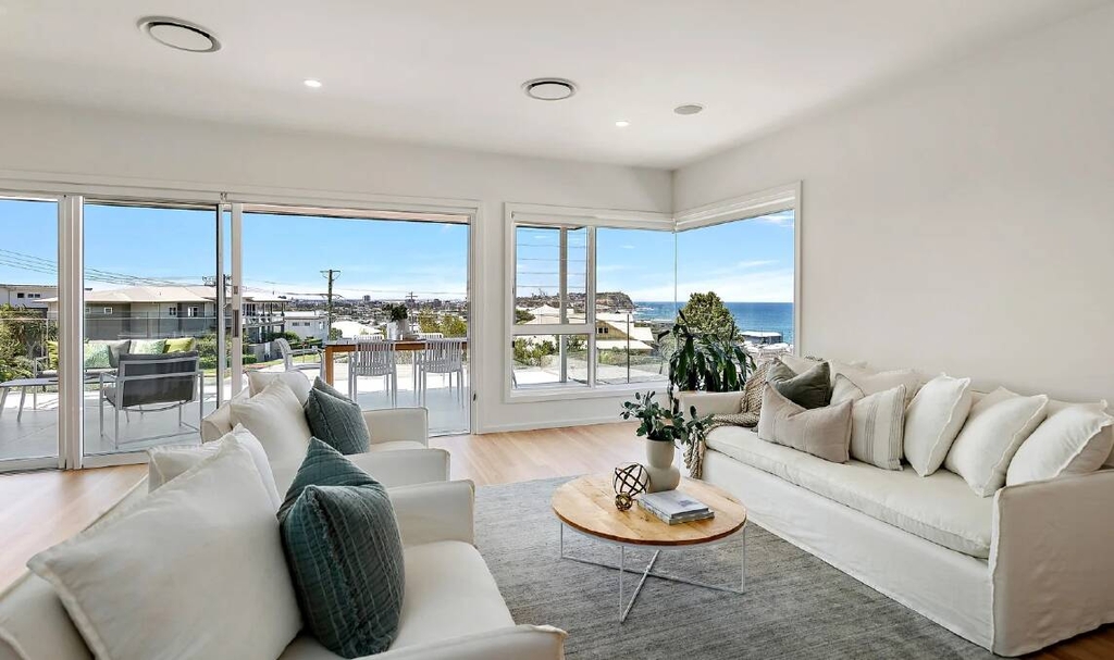 Former Knights player Mark Hughes lists renovated coastal family home